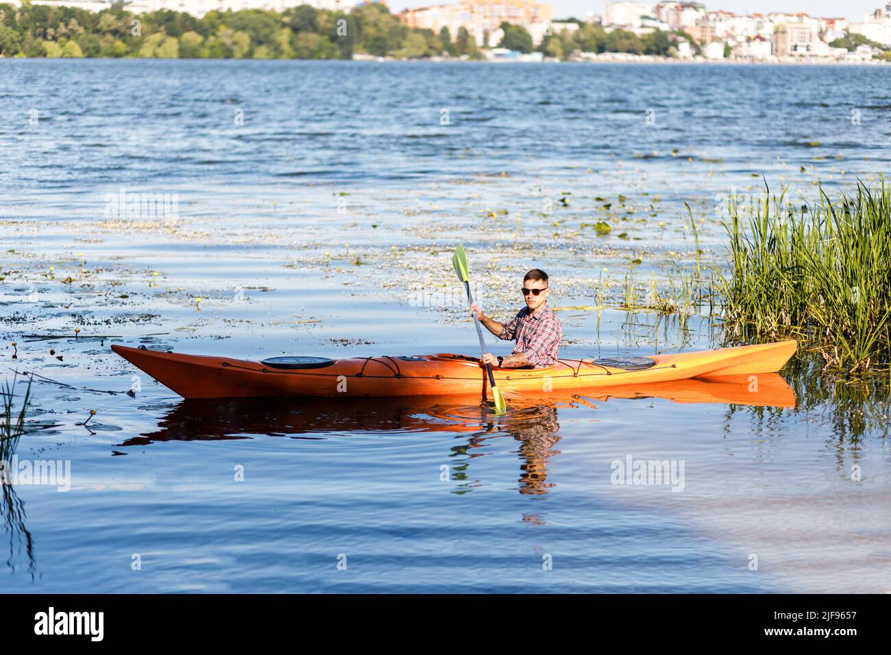 Strong man swim on kayak hi-res stock photography and images - Alamy