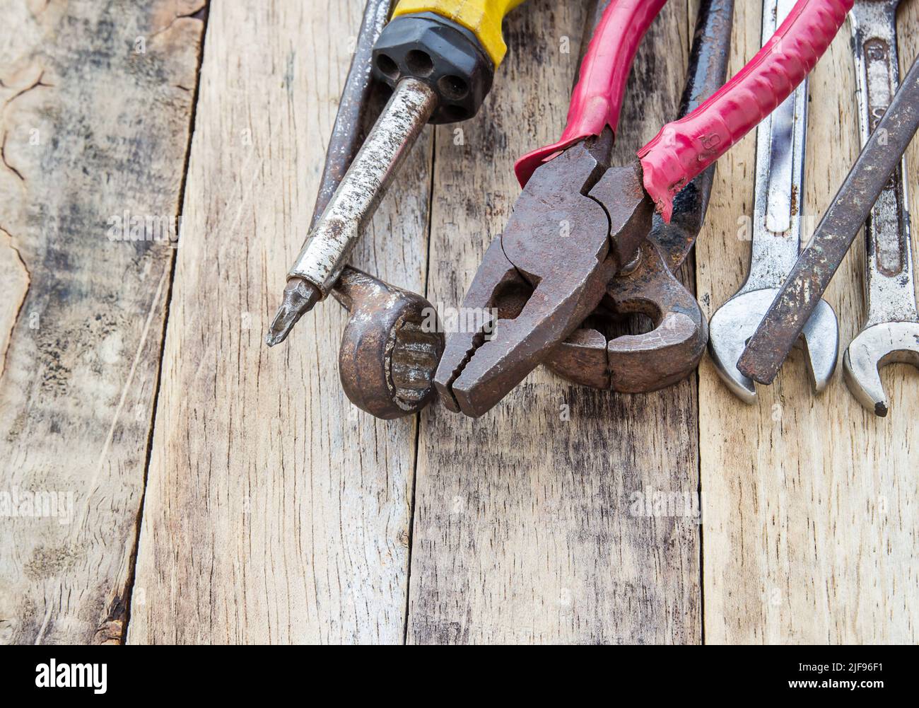 Close up bunch of used tools on wooden table background Stock Photo - Alamy