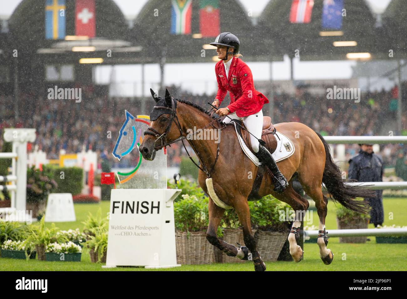 Jana WARGERS (GER) on Limbridge, rejoicing in the rain. Winner Germany ...