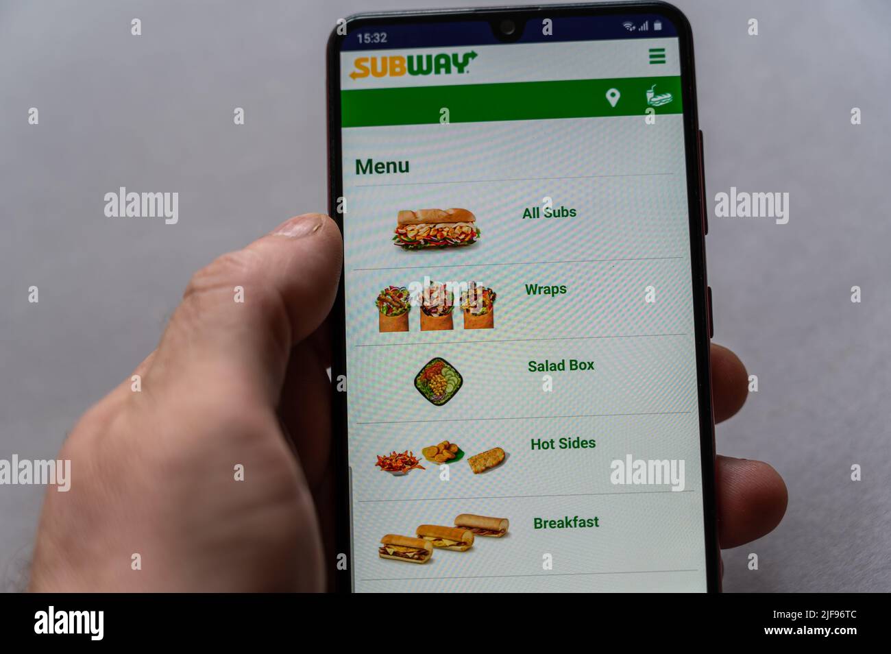 A man places an online order on the SUBWAY website. An American fast ...