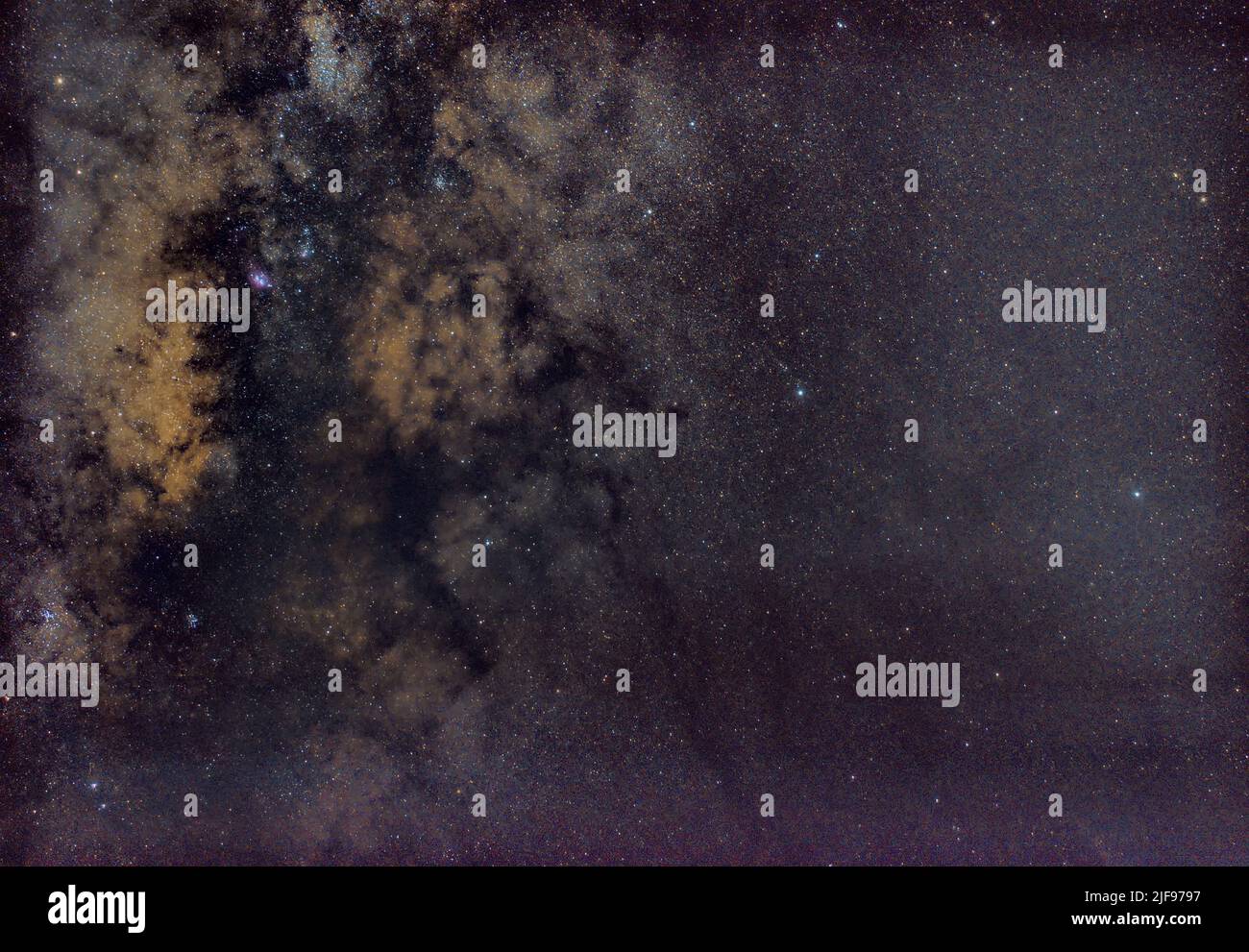 A Milky Way wallpaper in orange and purple shades Stock Photo - Alamy