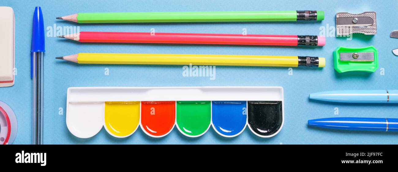 School supplies, colored pencils and watercolor paint pens, sticky ...