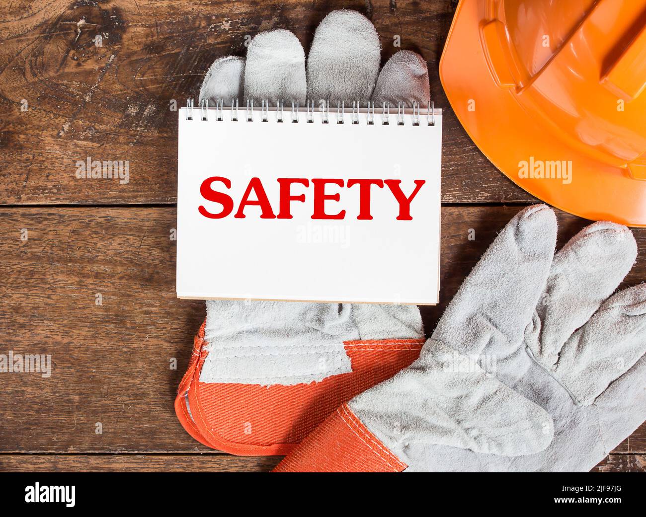 White card in safety glove with the inscription SAFETY Stock Photo - Alamy