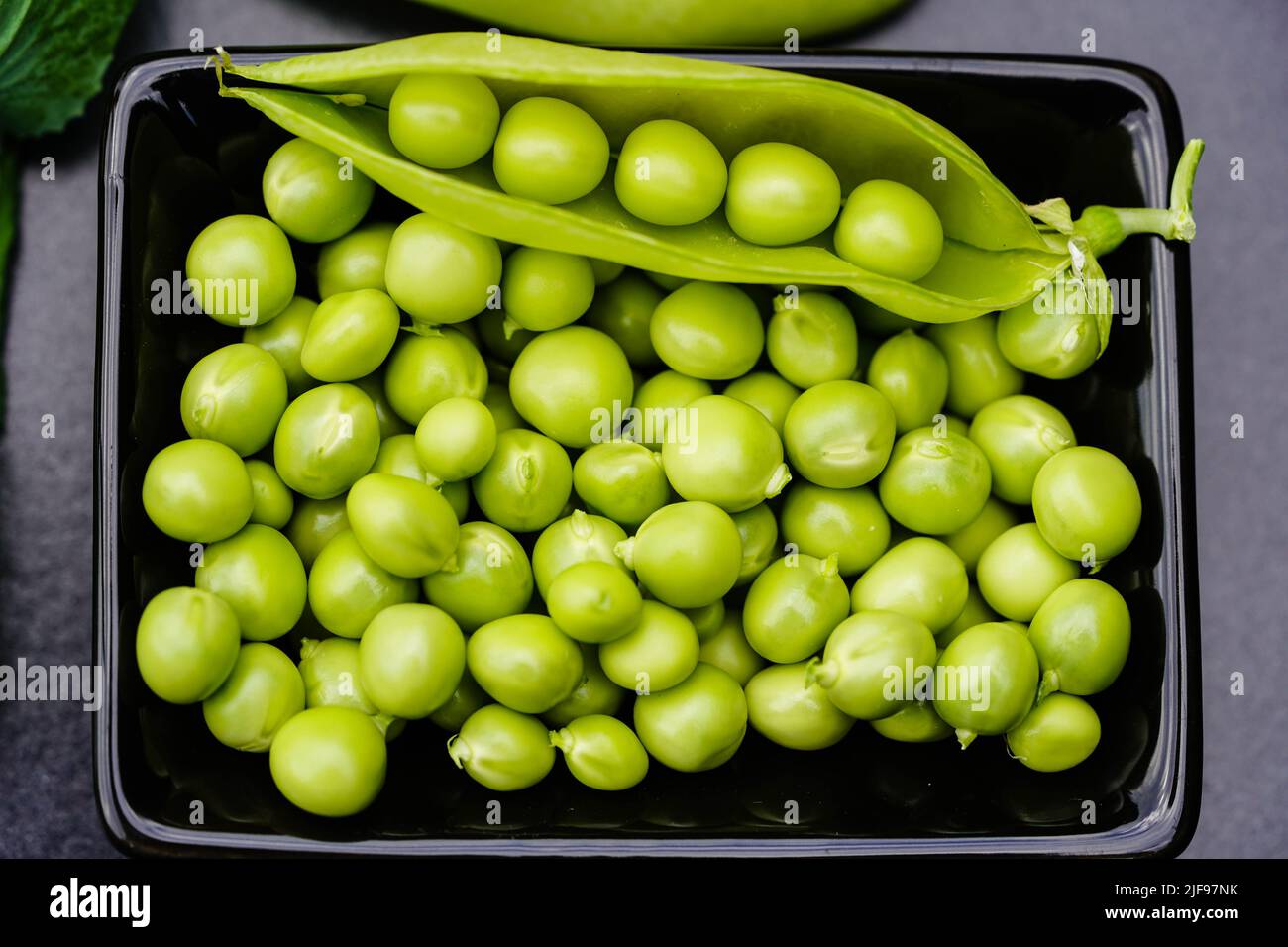 a stack of green sweet peas Pisum sativum Stock Photo - Alamy