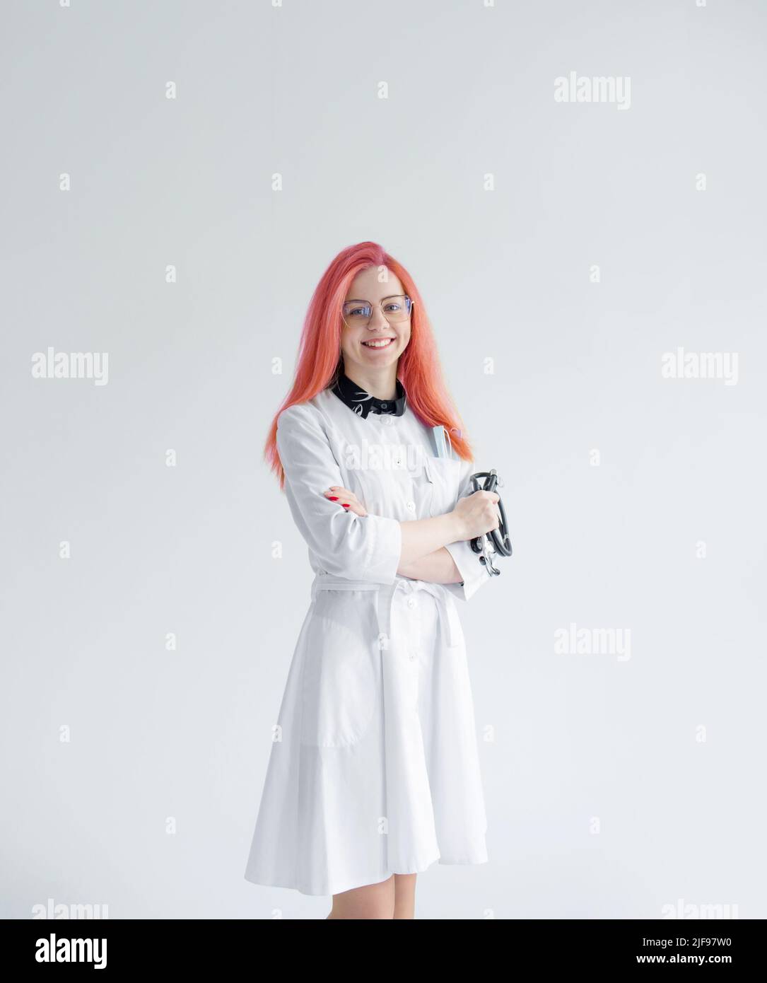 a doctor girl with red hair on a white background Stock Photo - Alamy