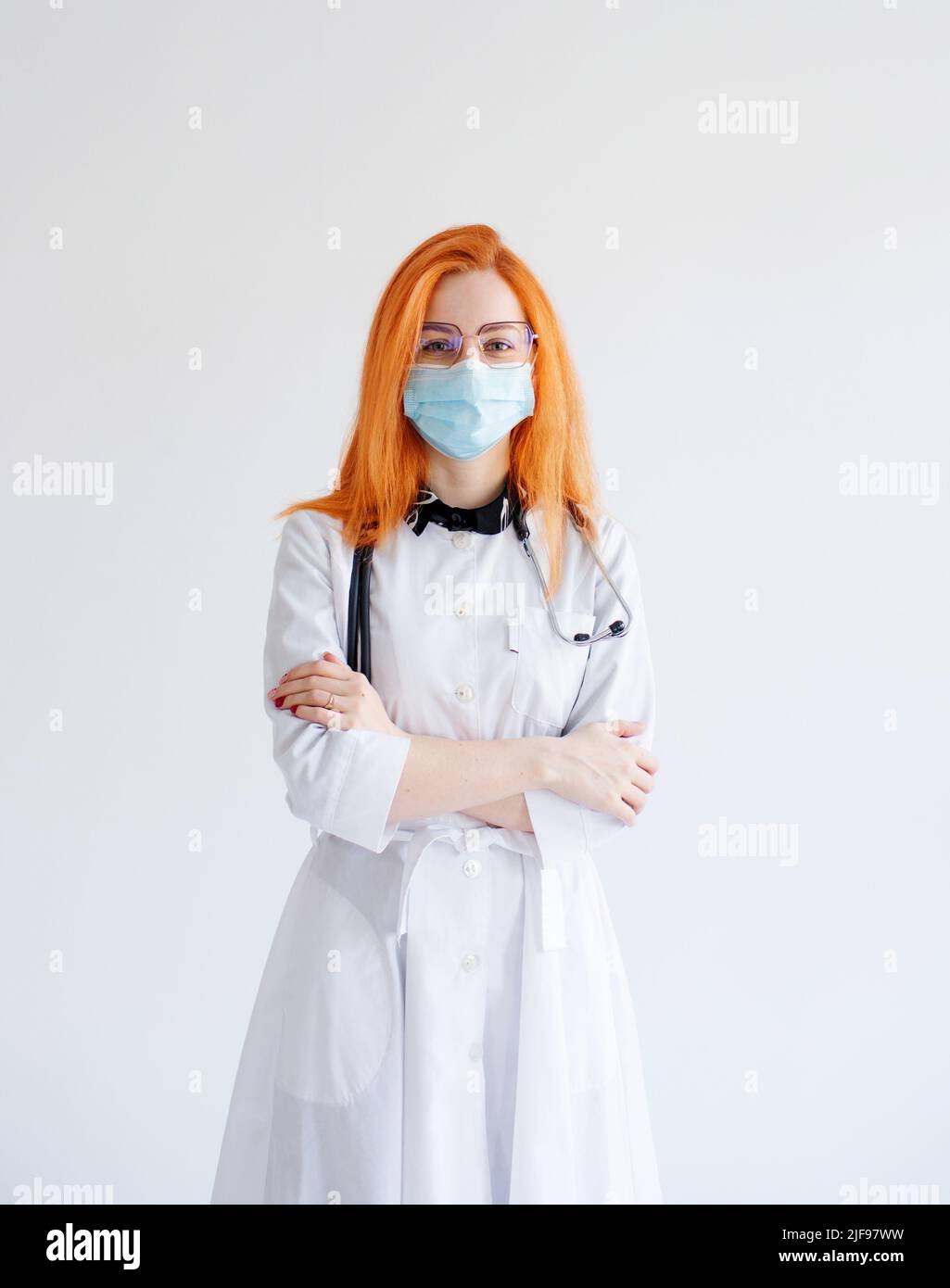 a doctor girl with red hair on a white background Stock Photo - Alamy