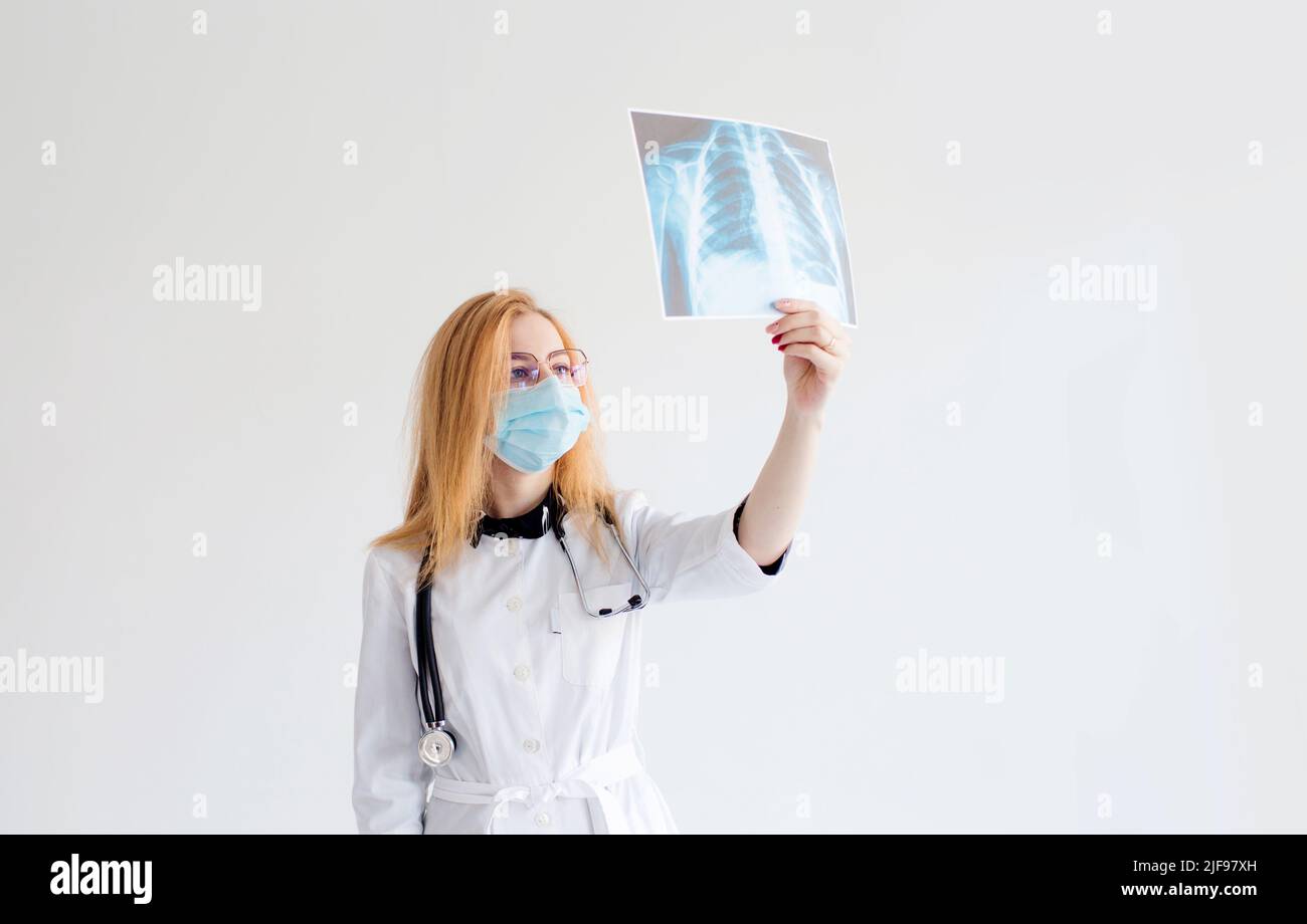 Portrait of a female doctor looking at a chest X-ray Stock Photo - Alamy
