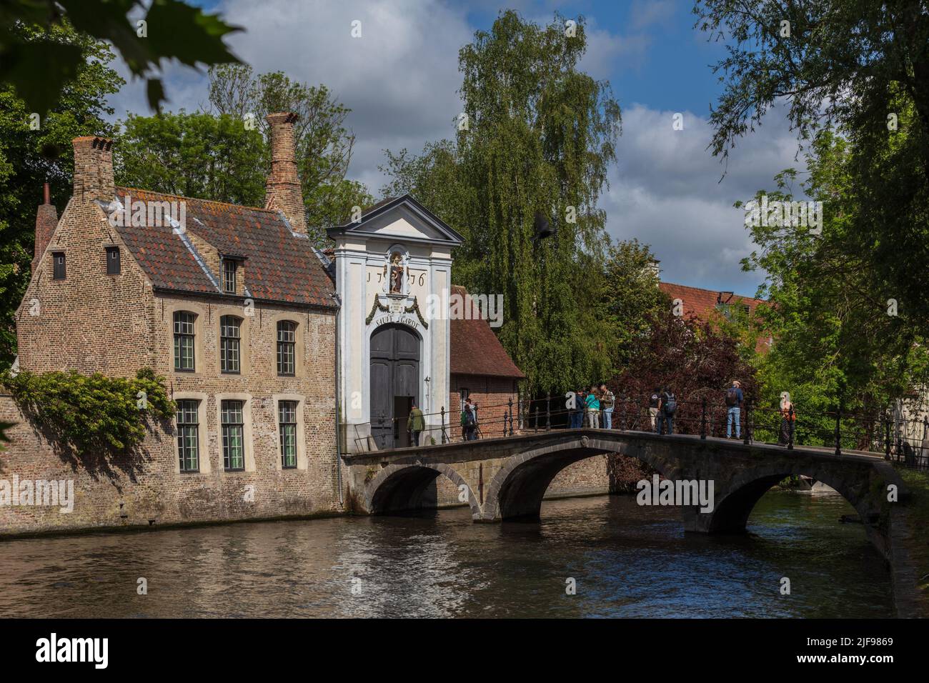 Begijnhof Bridge in the medieval town of Bruges. The bridge takes you ...