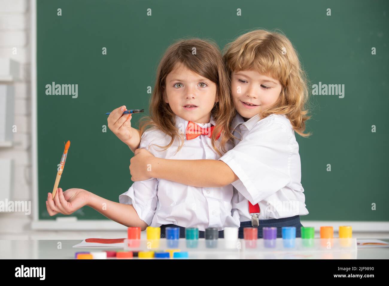 Portrait school kids hugging. Children drawing on elementary school. Kids art, creativity ...