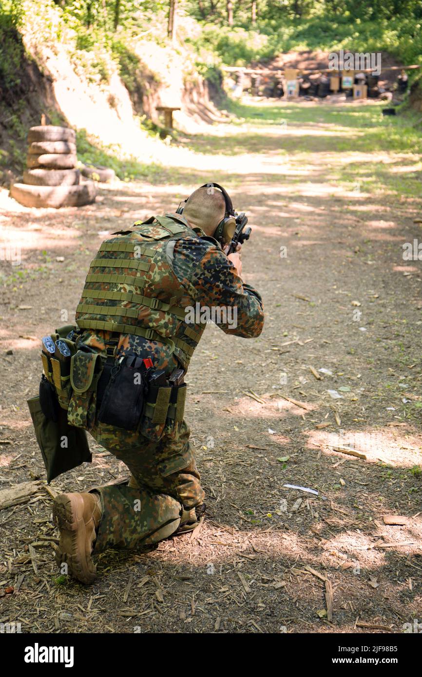 Portrait of a Ukrainian military man with a assault rifle Ar-15 in his ...