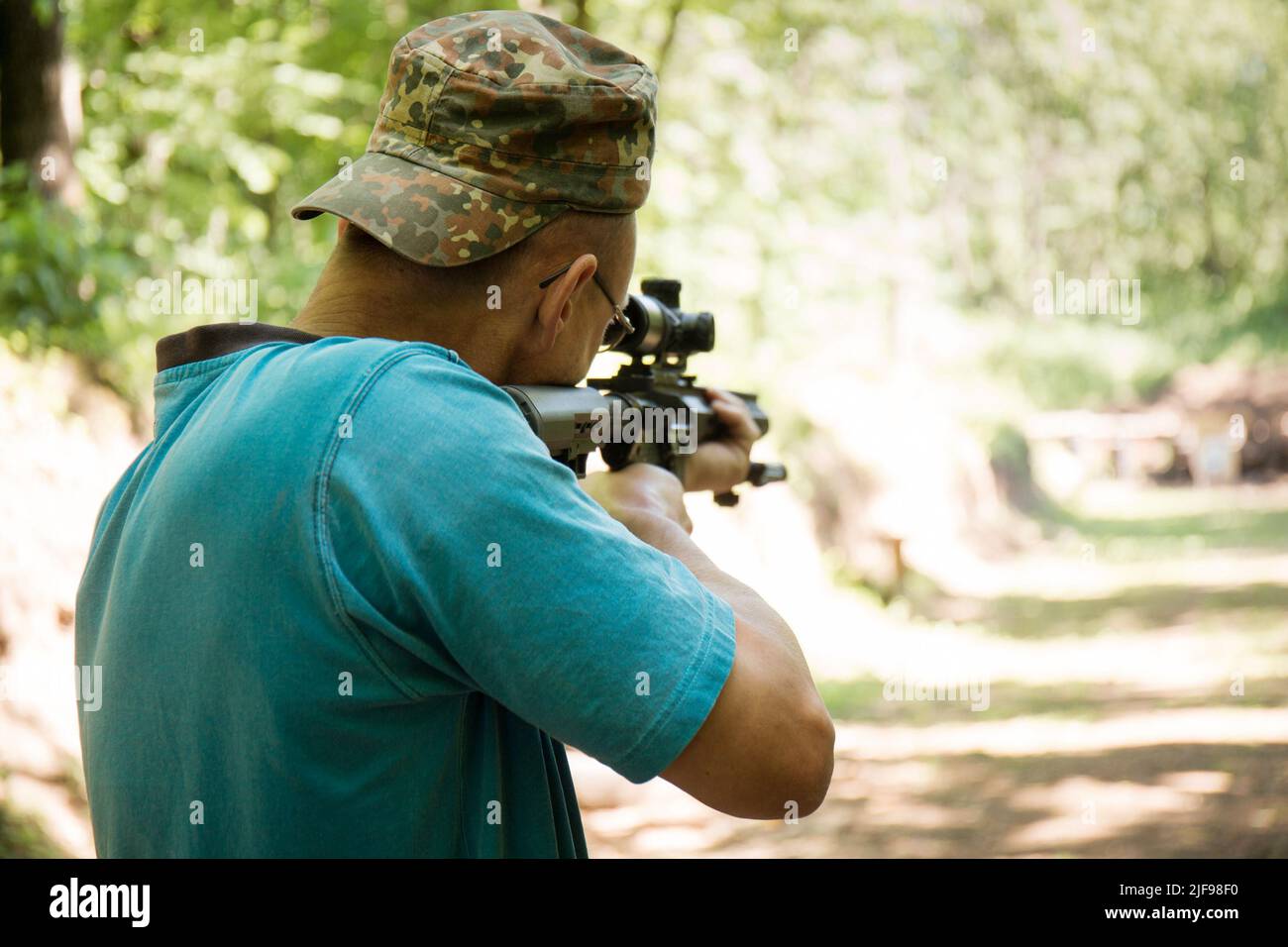 A Ukrainian civilian man is training to shoot an machine gun Ar-15 ...