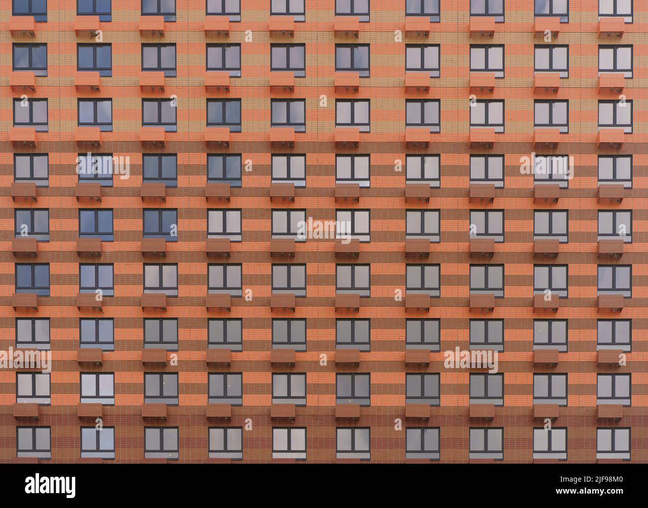 Facade of a new multi-apartment high-rise residential building with ...