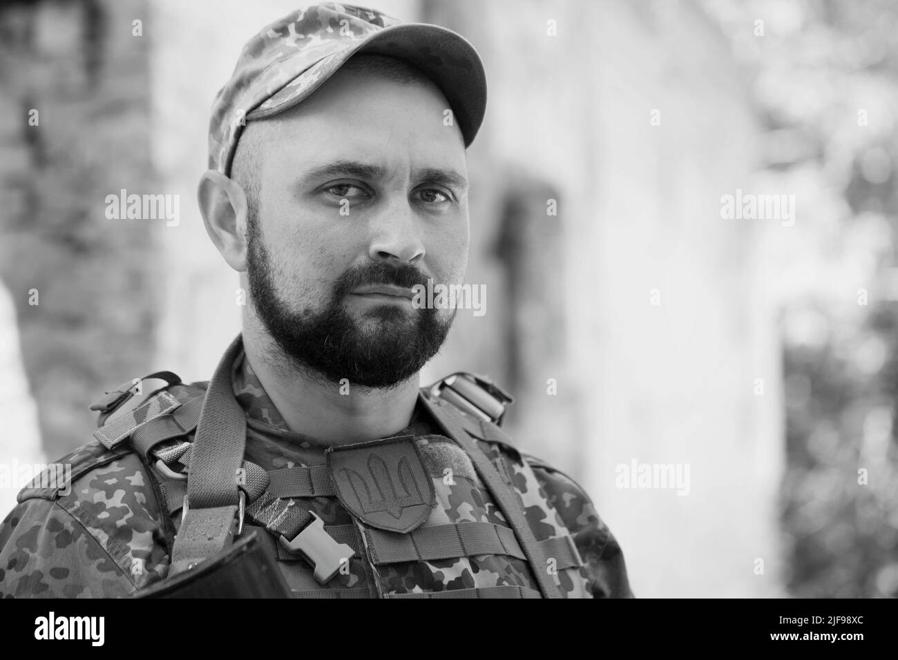 Portrait of a Ukrainian military man with a Kalashnikov assault rifle ...