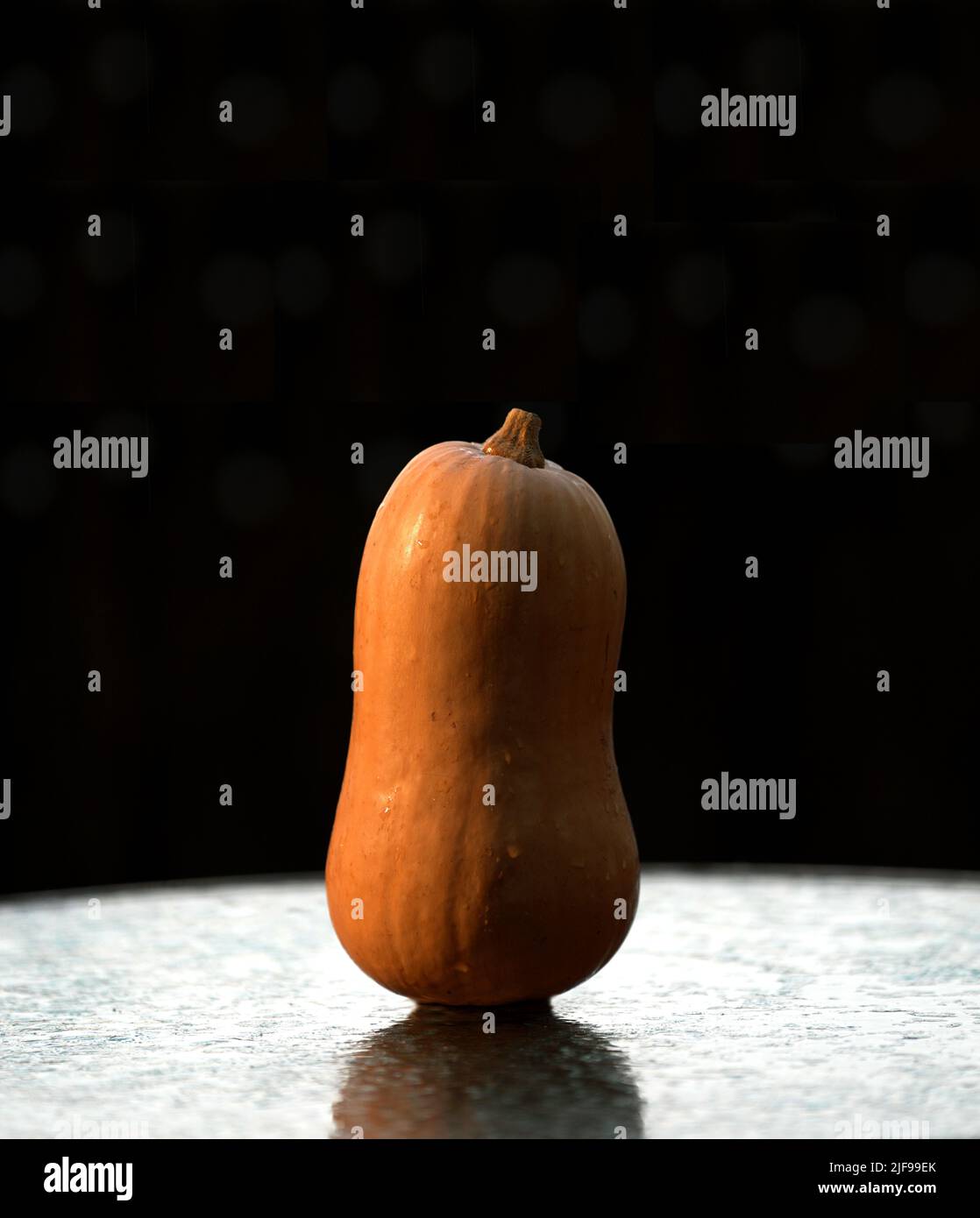 Wet pumpkin butternut squash isolated on black background Stock Photo ...
