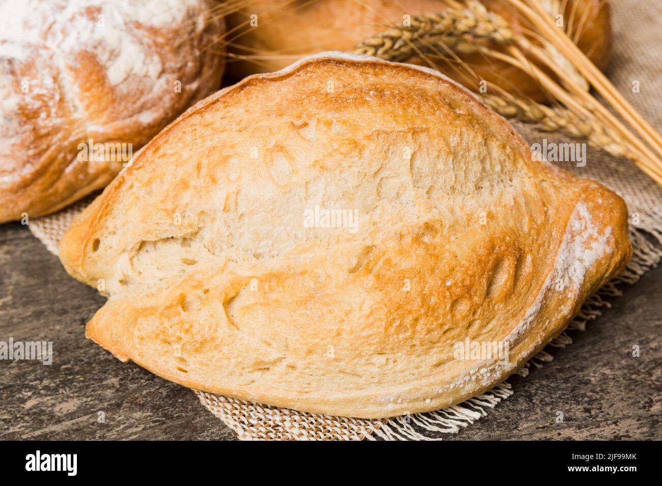 Homemade natural breads. Different kinds of fresh bread as background ...