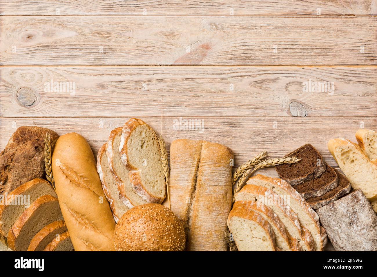 Homemade natural breads. Different kinds of fresh bread as background ...