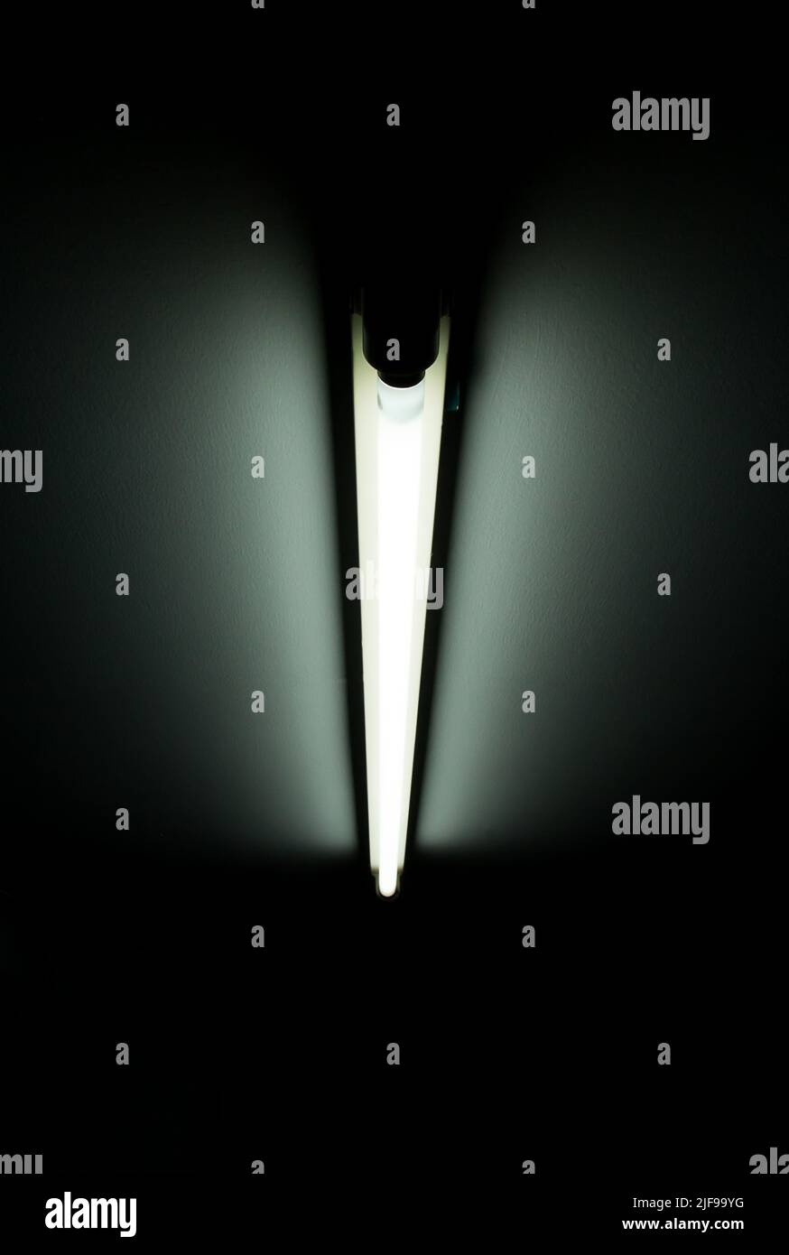 Detail of a fluorescent light tube on a wall. fluorescent light tube ...