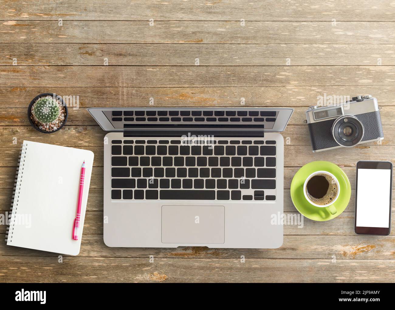 Office desk with laptop computer and cup of coffee Vintage hipster ...