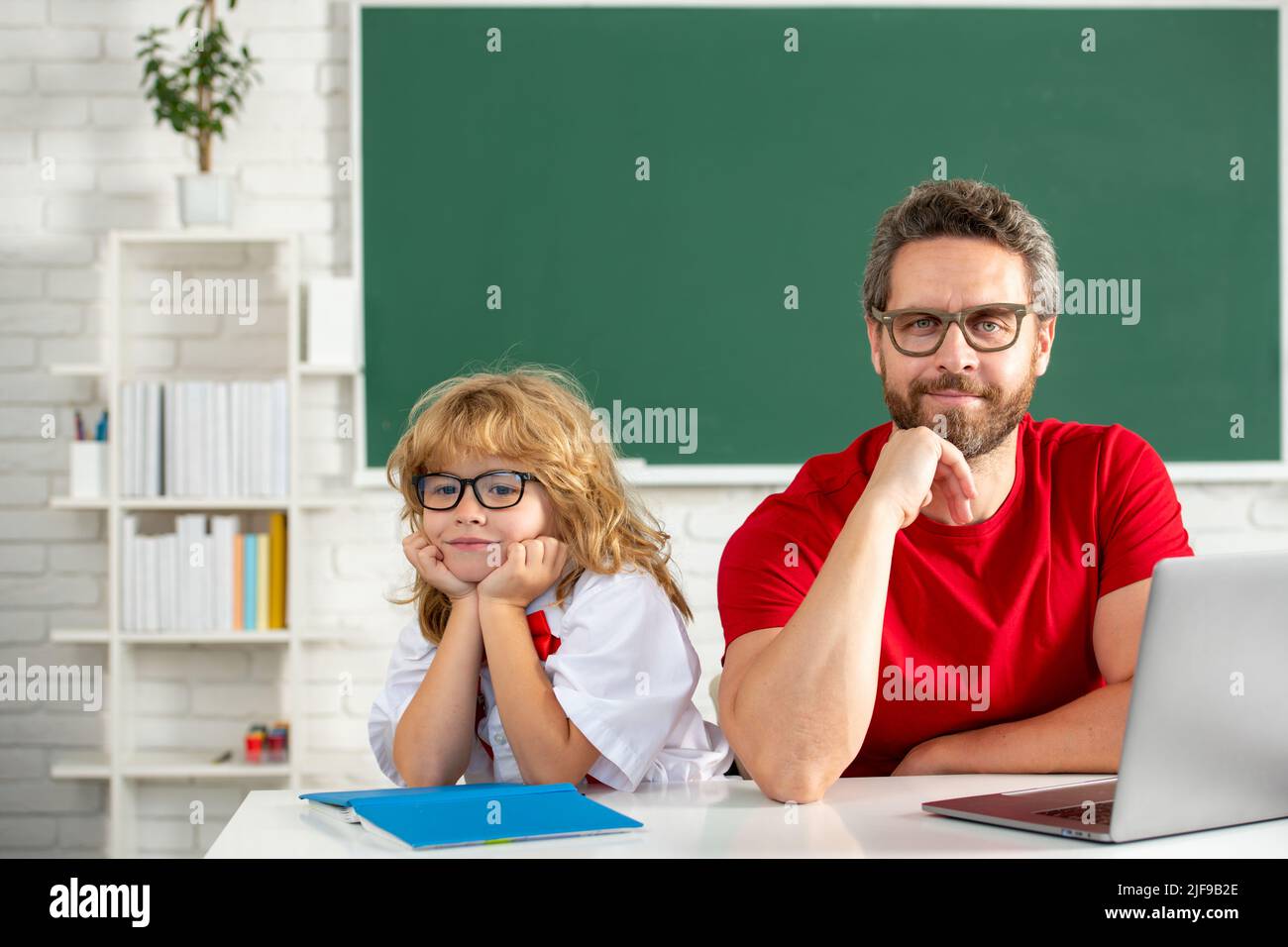 School pupil from elementary school with teacher in classroom Stock ...