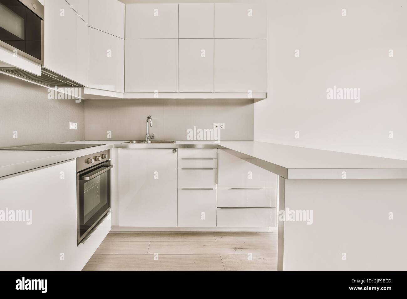 Interior of empty white kitchen with windows and wooden parquet floor ...