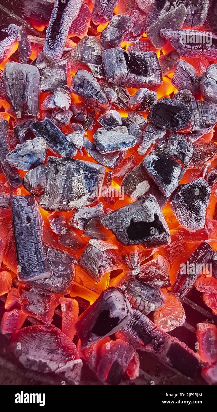 Hot red coals texture. Burning charcoal background. Close-up of hot ...
