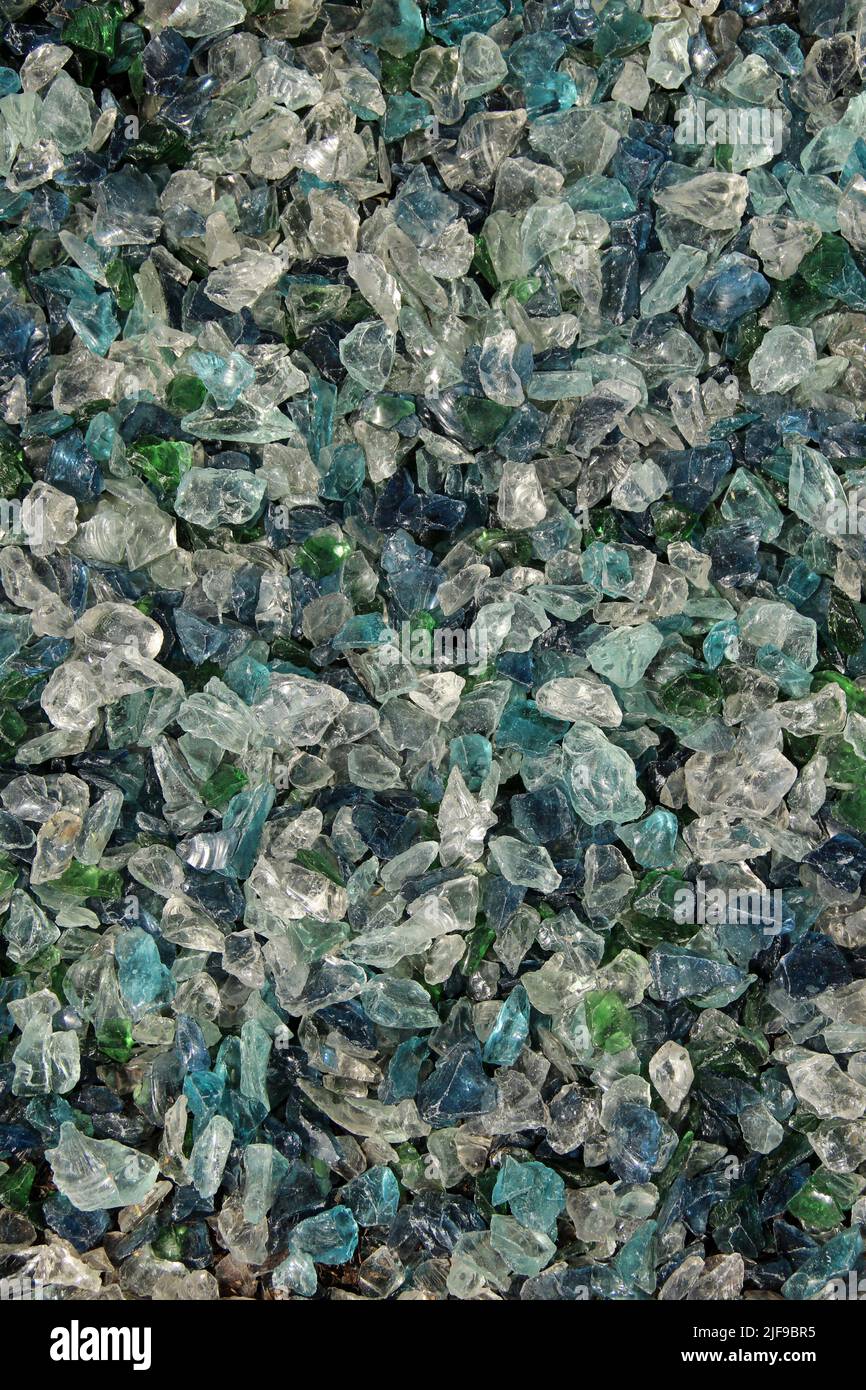 Colored glass pieces with sharp edges. Abstract broken glass background ...
