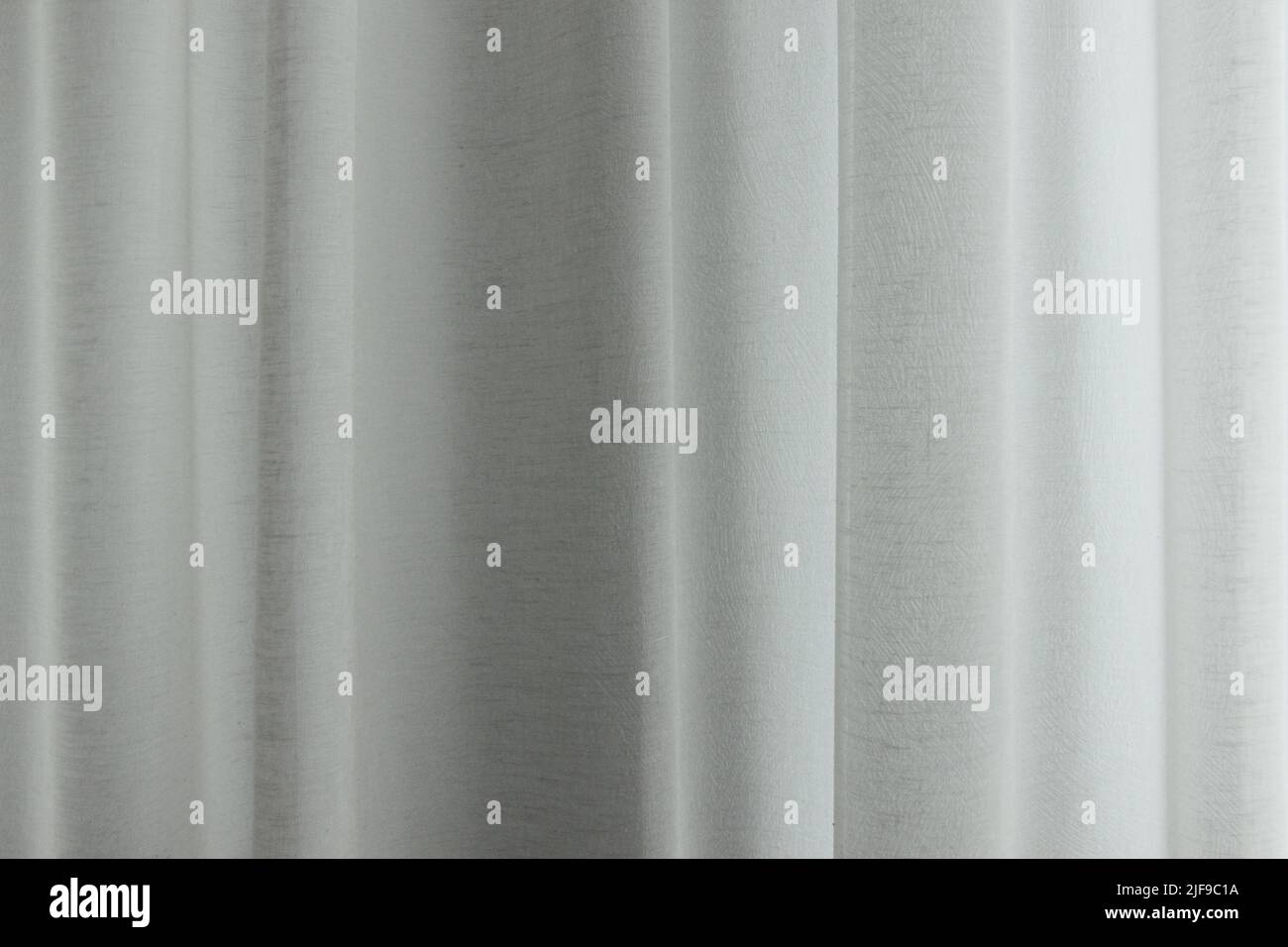 Linen curtains make folds. Linen fabrics in the interior. Soft textile ...
