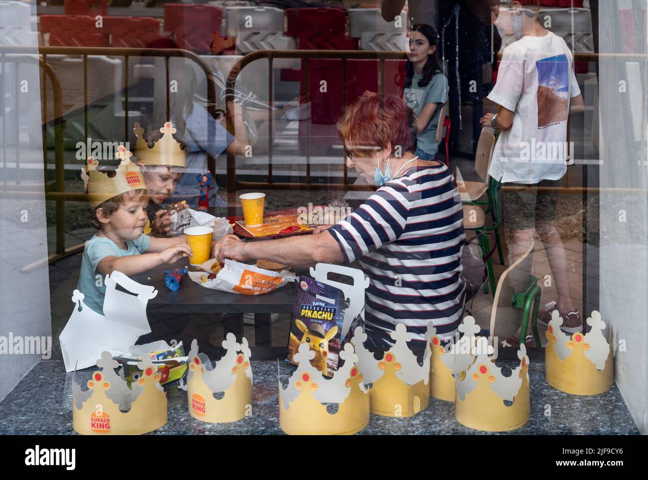 Customer are seen wearing paper crowns at the American chain of ...