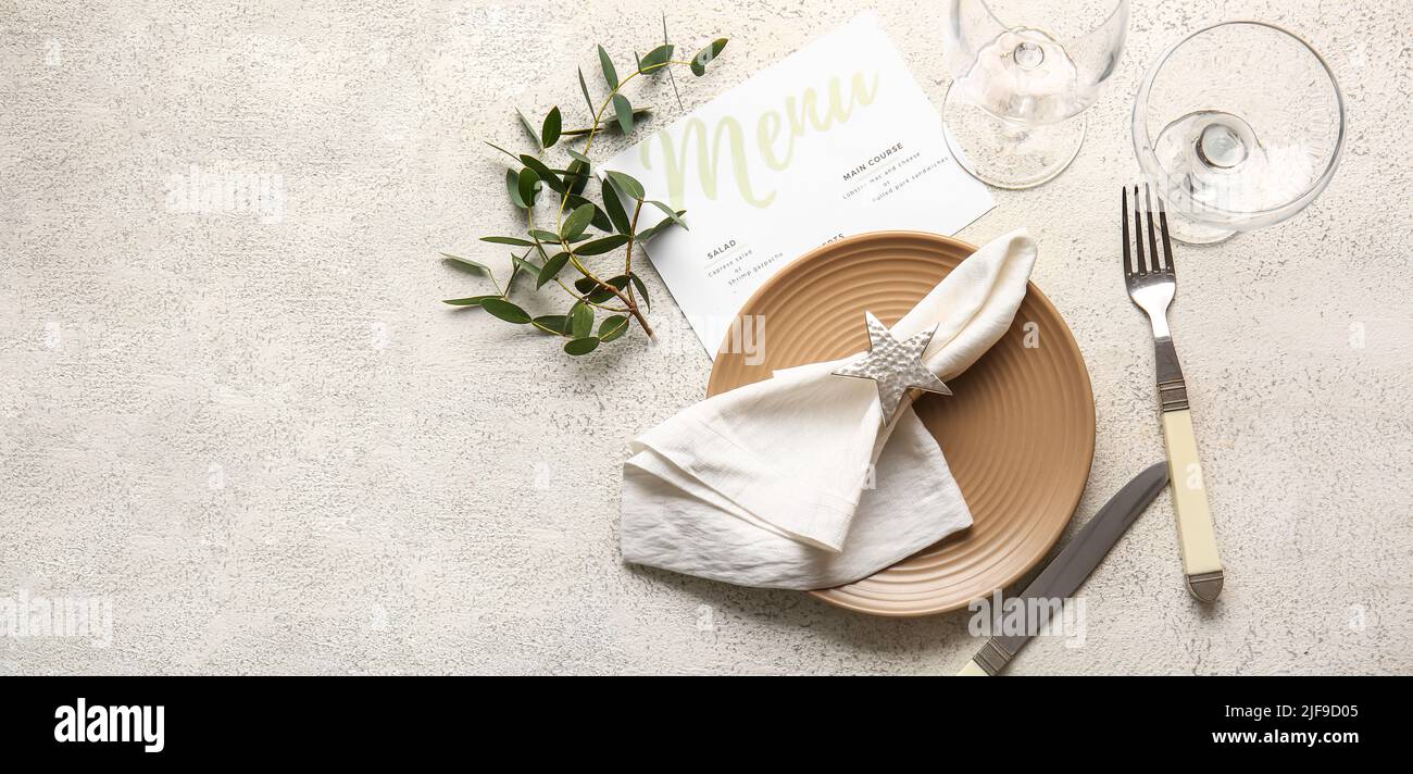 Beautiful table setting with floral decor on light background with ...