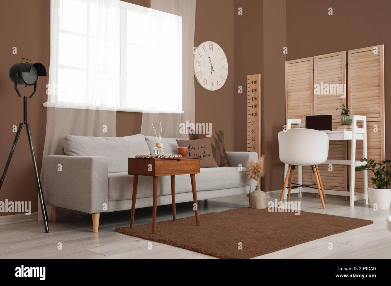Interior of modern living room in brown colors Stock Photo - Alamy