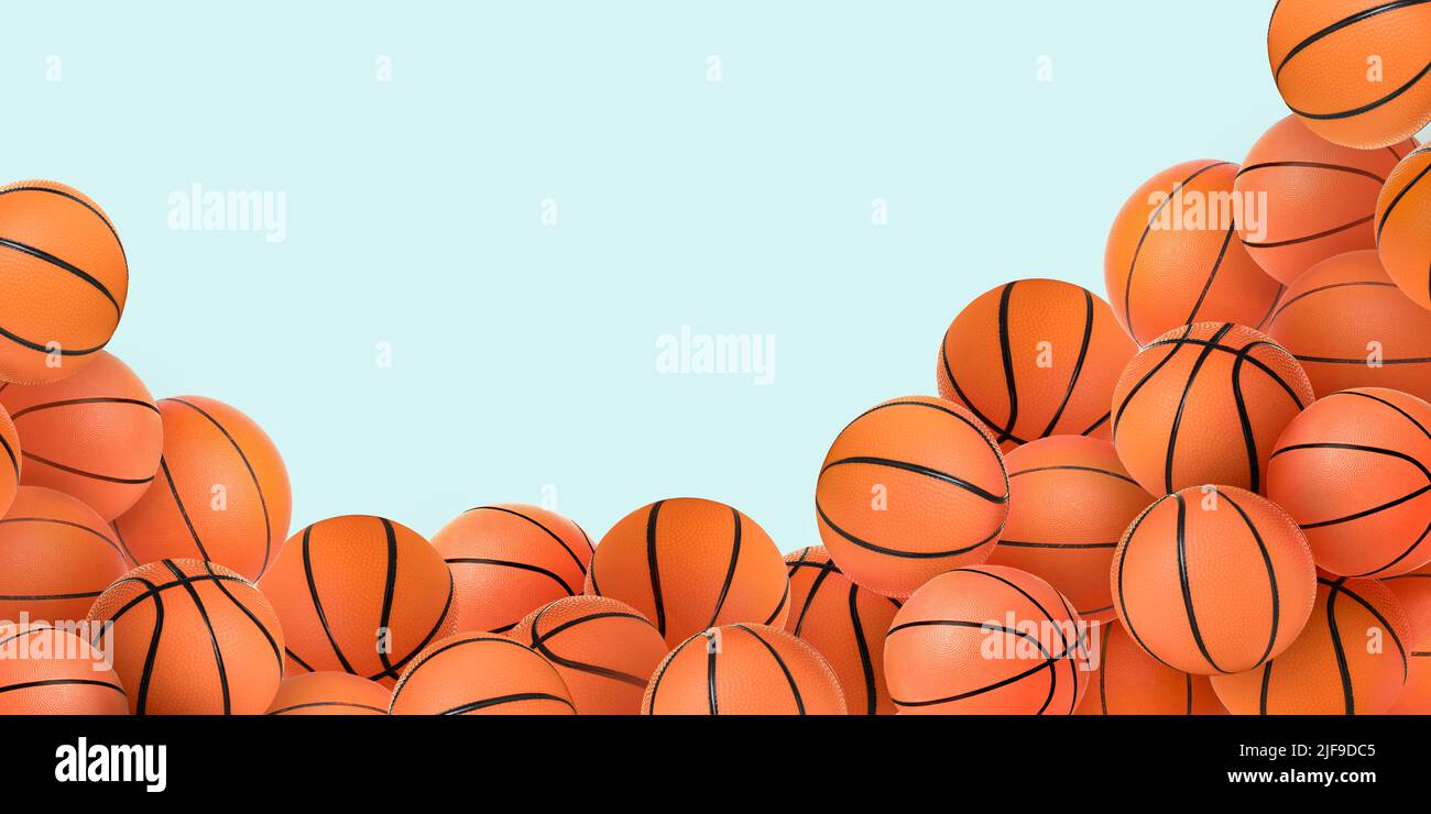 Many basketball balls on light blue background with space for text ...