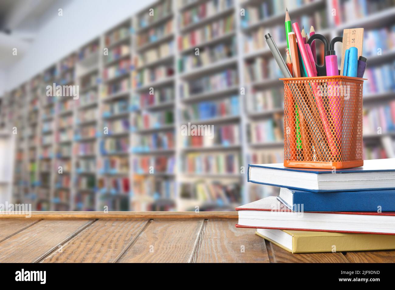 School supplies on table in modern library Stock Photo - Alamy