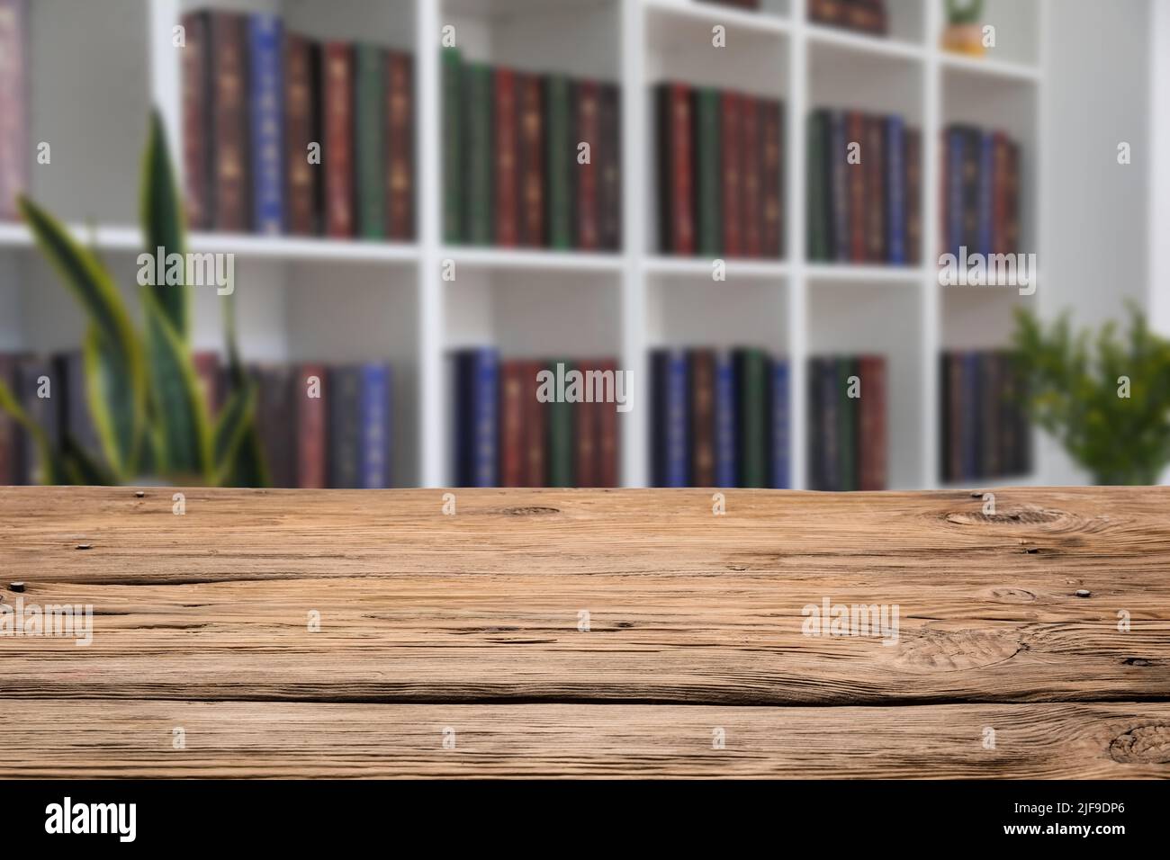 Empty wooden table in modern library Stock Photo - Alamy