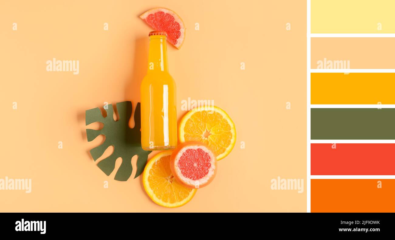 Bottle of fresh citrus soda on orange background. Different color ...