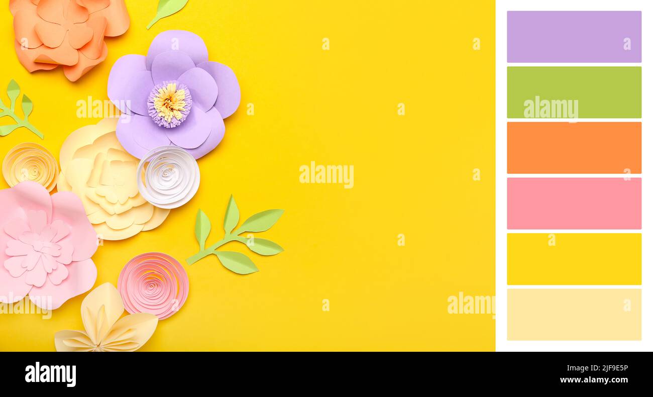 Beautiful handmade paper flowers on yellow background. Different color ...