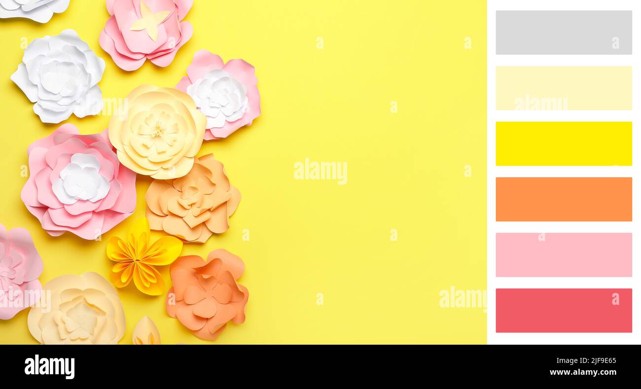 Beautiful handmade paper flowers on yellow background. Different color ...