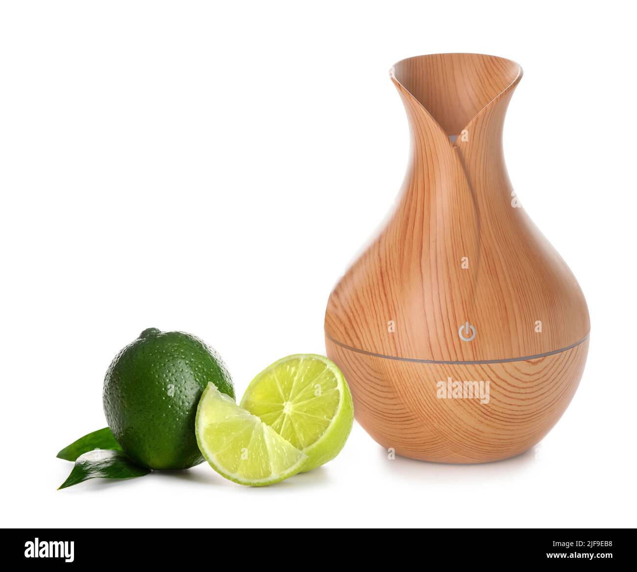 Aroma oil diffuser and lime on white background Stock Photo - Alamy