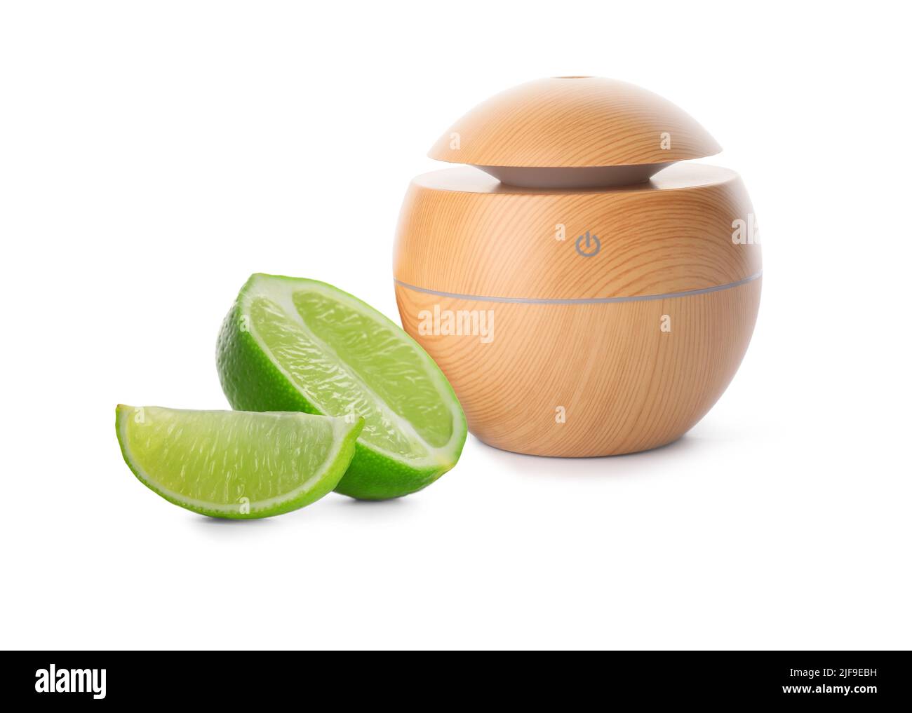 Aroma oil diffuser and lime on white background Stock Photo - Alamy