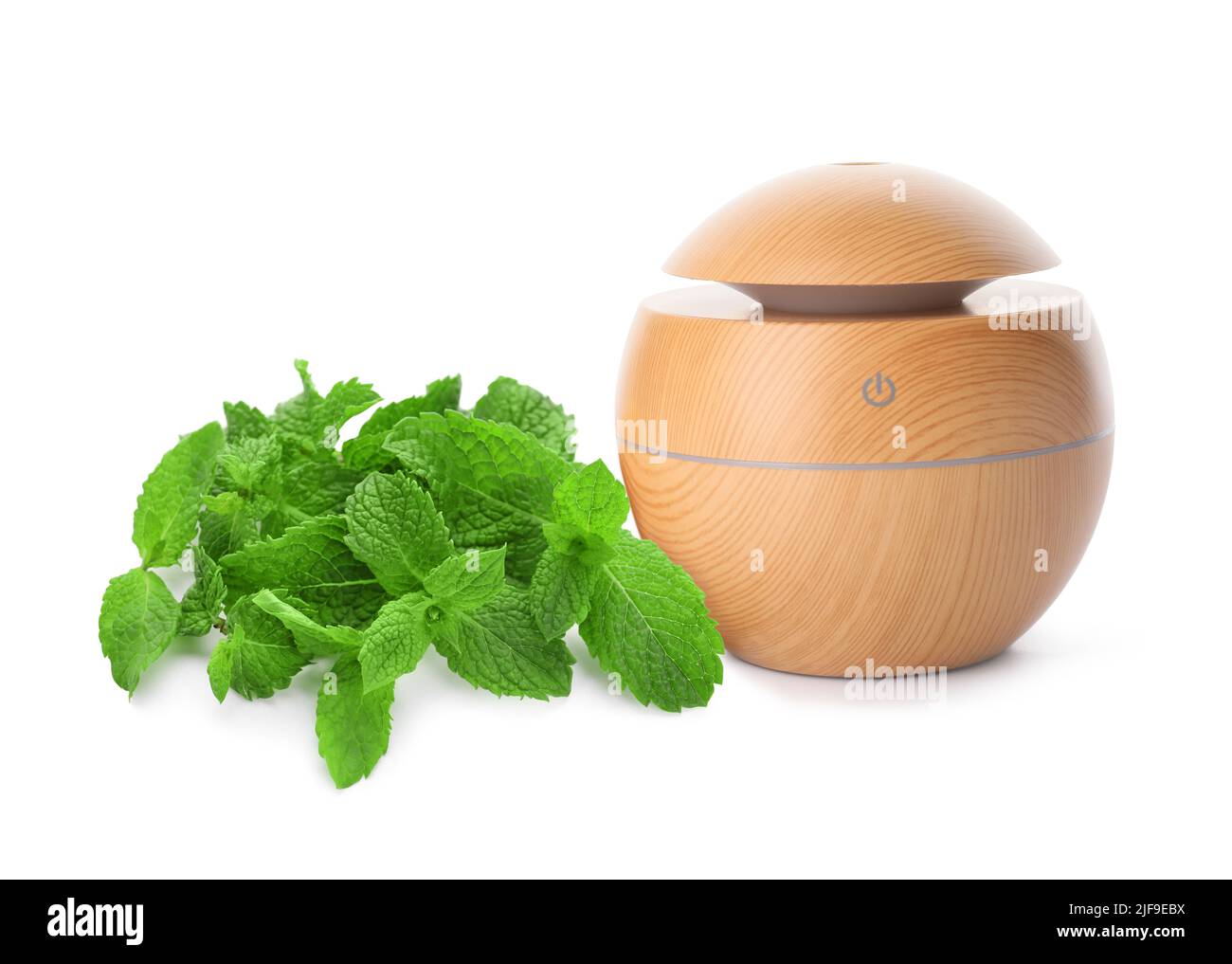 Aroma oil diffuser and mint on white background Stock Photo - Alamy
