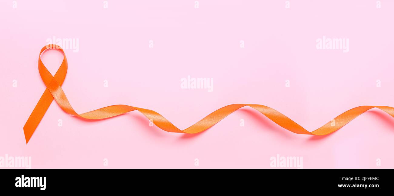Orange ribbon on pink background. Kidneys cancer awareness concept ...