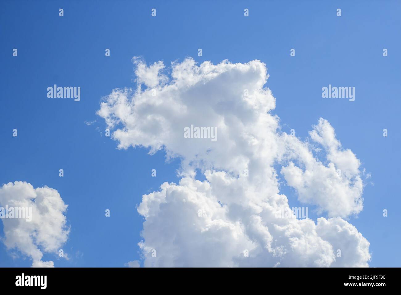 Blue sky with white cloud background for any design Stock Photo - Alamy