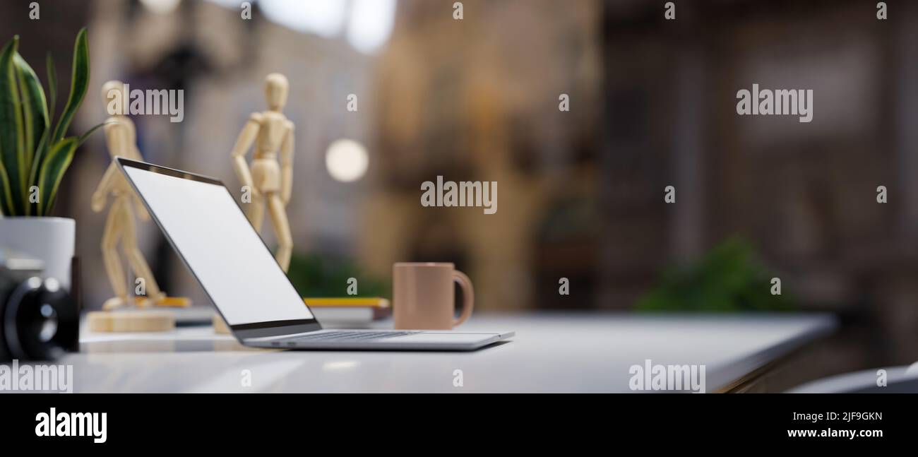 Close-up image, Workspace with laptop computer white screen mockup and ...