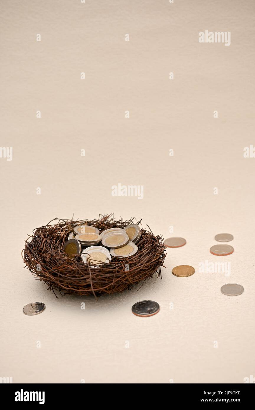 Thai baht, Coins of Thailand in a bird nest on beige background. Money ...