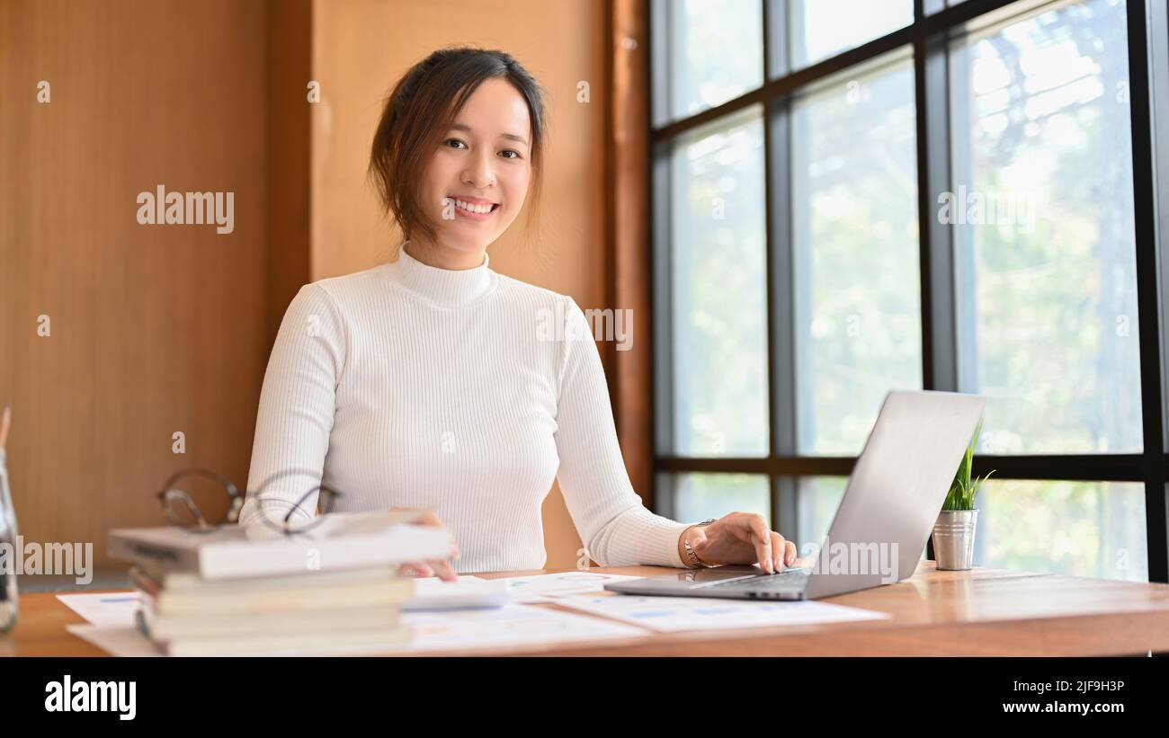 Beautiful charming millennial asian businesswoman or female ...