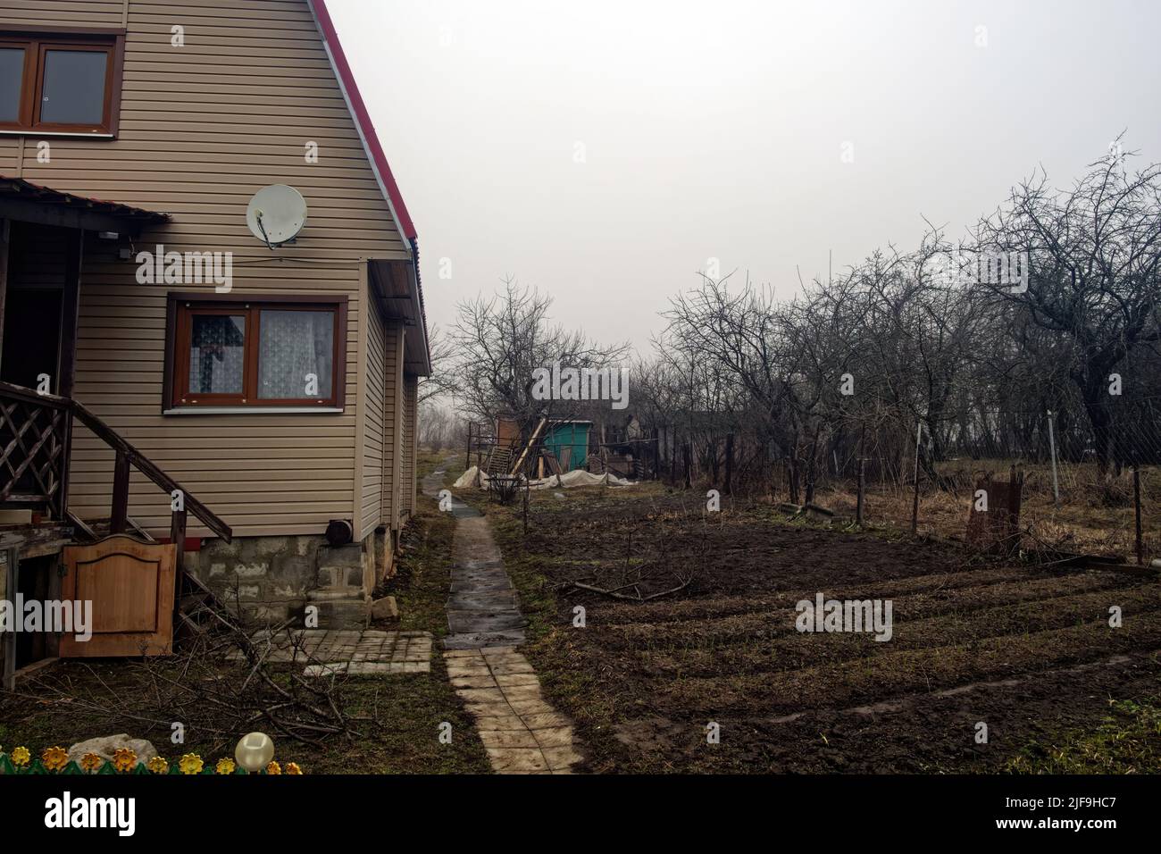 old wooden house in the garden, in spring Stock Photo - Alamy
