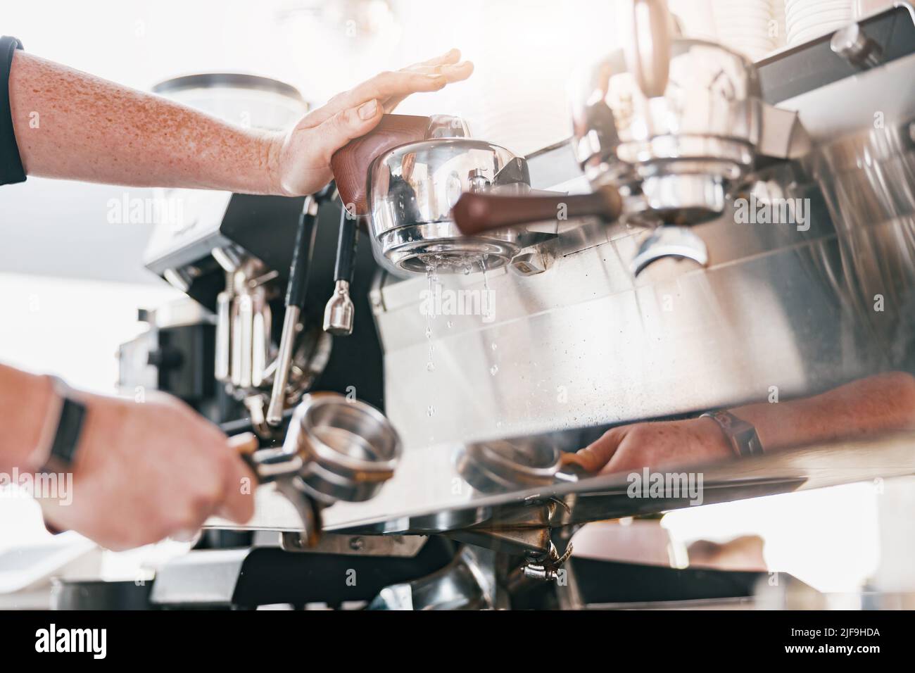 Process of preparing coffee on coffee machine in cafe Stock Photo - Alamy