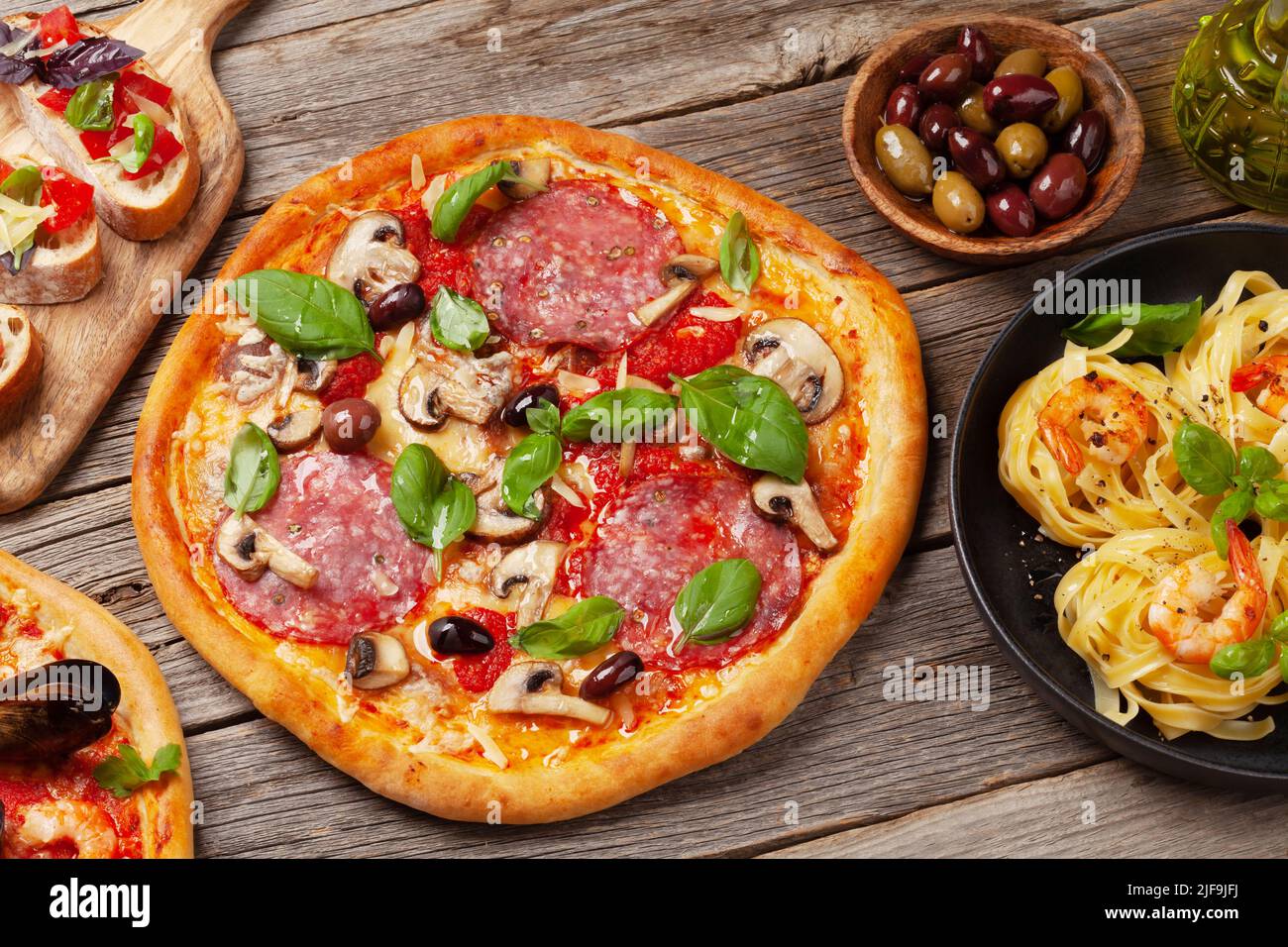 Italian cuisine. Pasta, pizza, olives and antipasto toasts Stock Photo ...