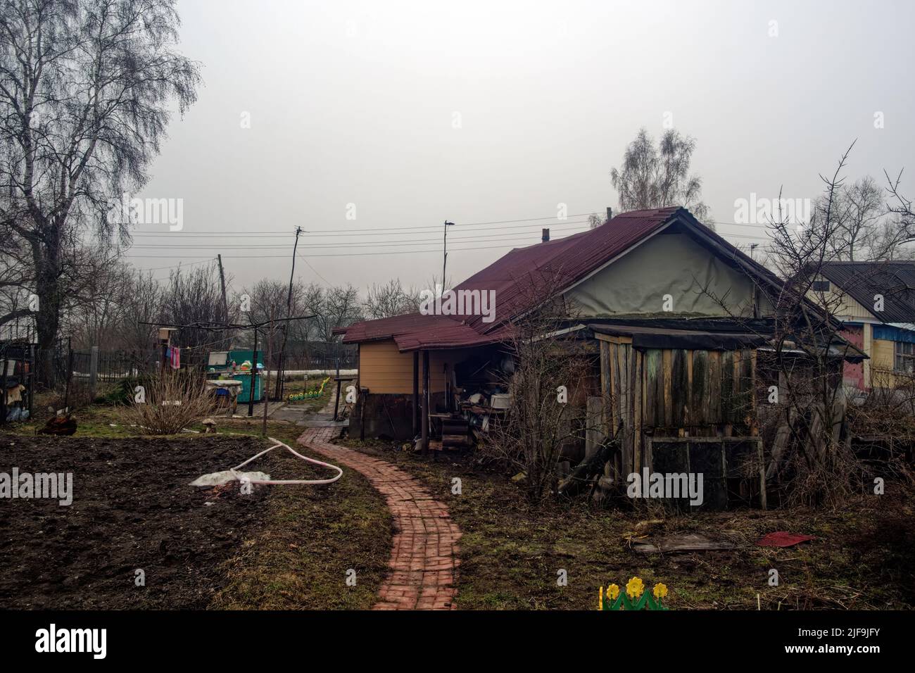 old wooden house in the garden, in spring Stock Photo - Alamy