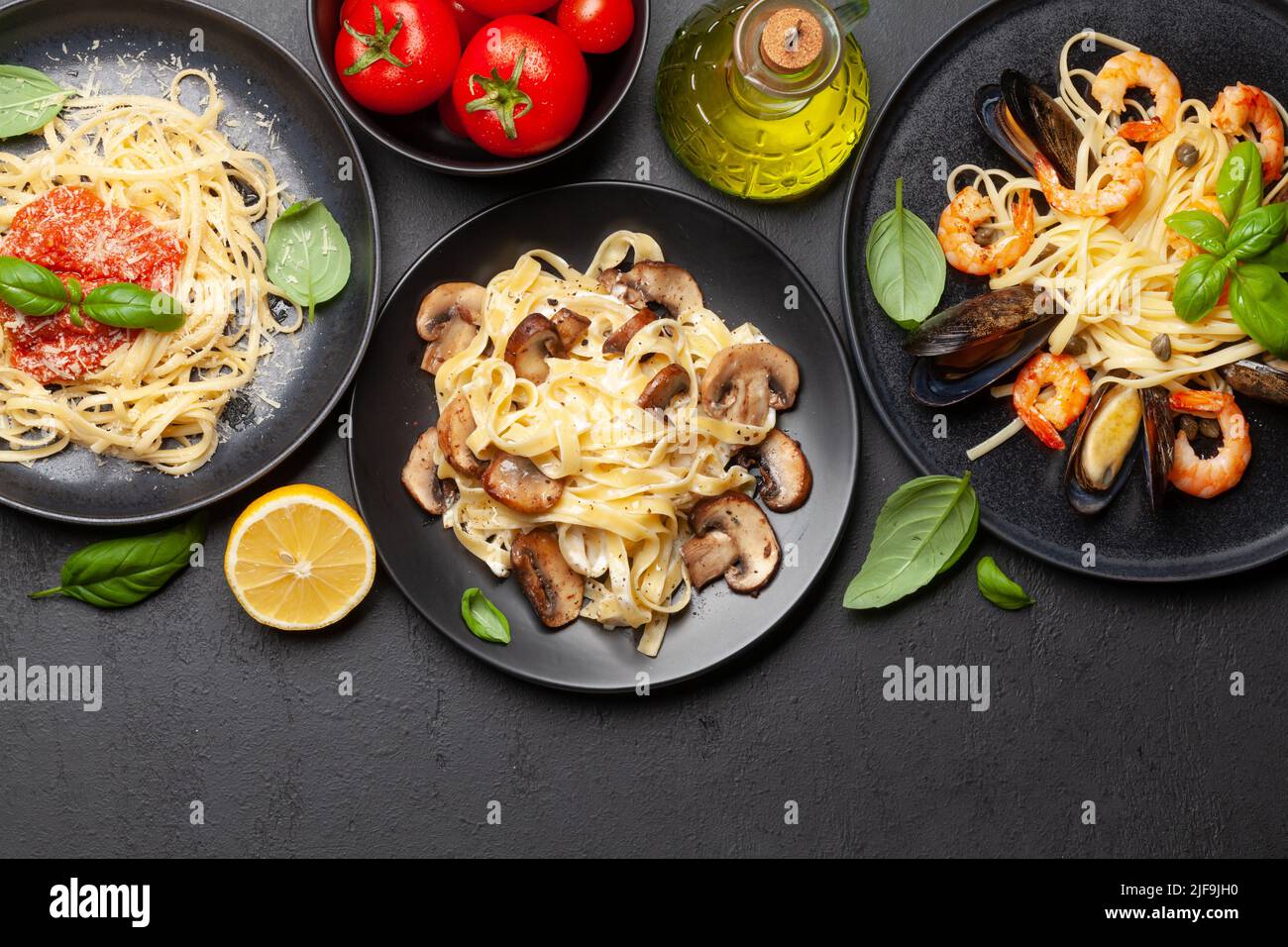 Various Italian pasta. Seafood, mushroom and tomato sauce pasta ...