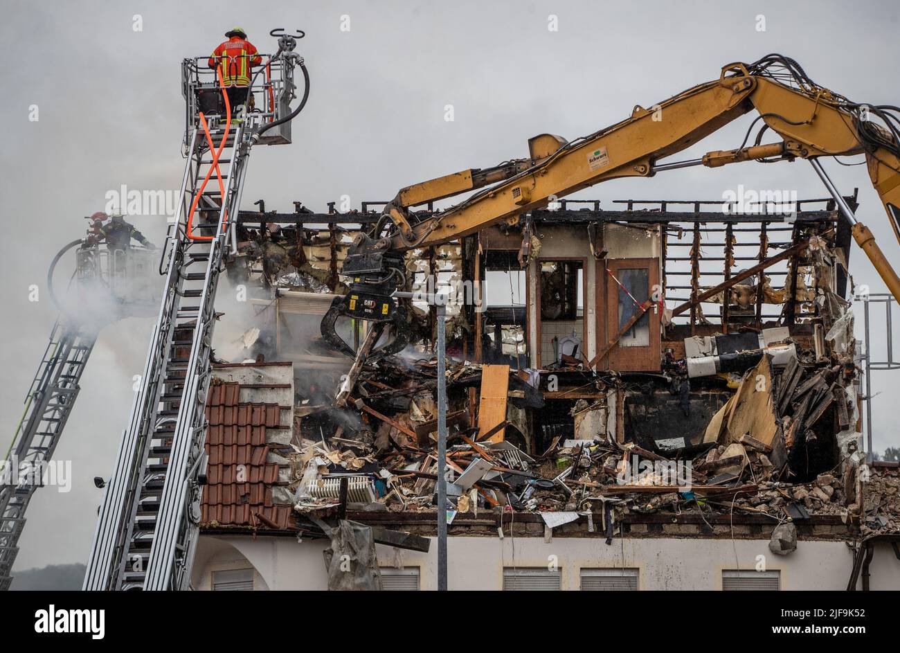 Gerlingen, Germany. 01st July, 2022. After a fire, demolition work and ...